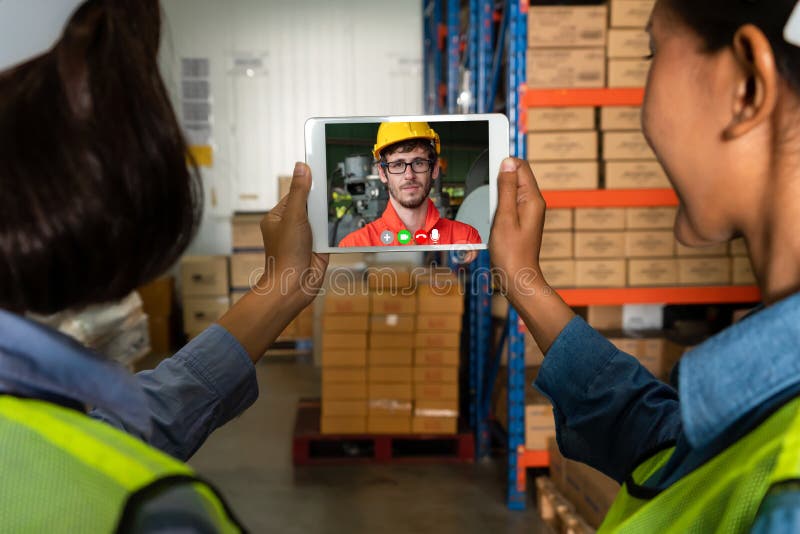 Warehouse Staff Talking on Video Call at Computer Screen in Storage ...