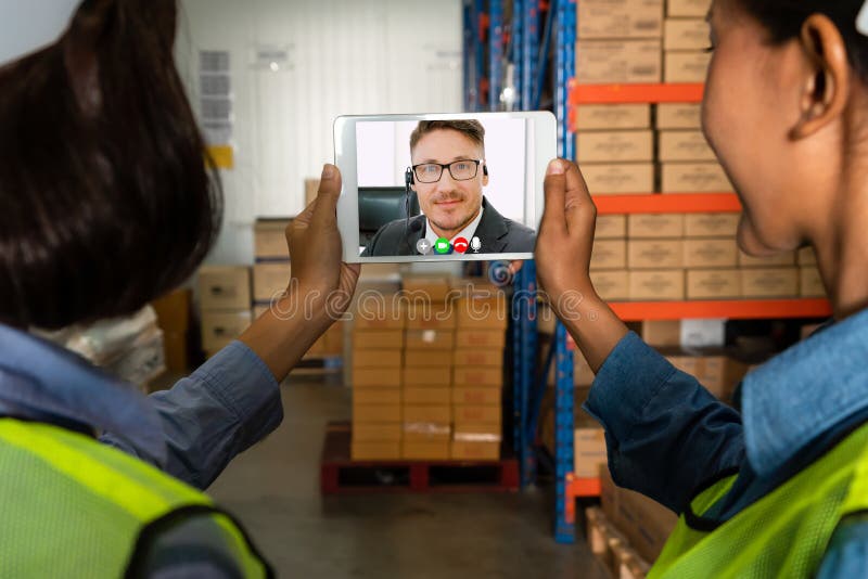 Warehouse Staff Talking on Video Call at Computer Screen in Storage ...