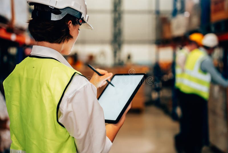 Warehouse Supervisor Using Tablet for Controlling and Checking Goods on ...