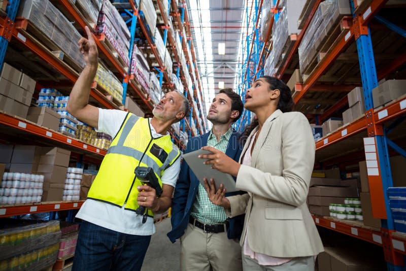 Warehouse Team Discussing with Digital Tablet Stock Photo - Image of ...