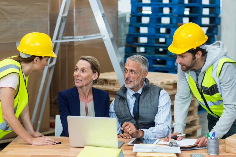 Warehouse Team Having a Meeting Stock Photo - Image of beard, container ...