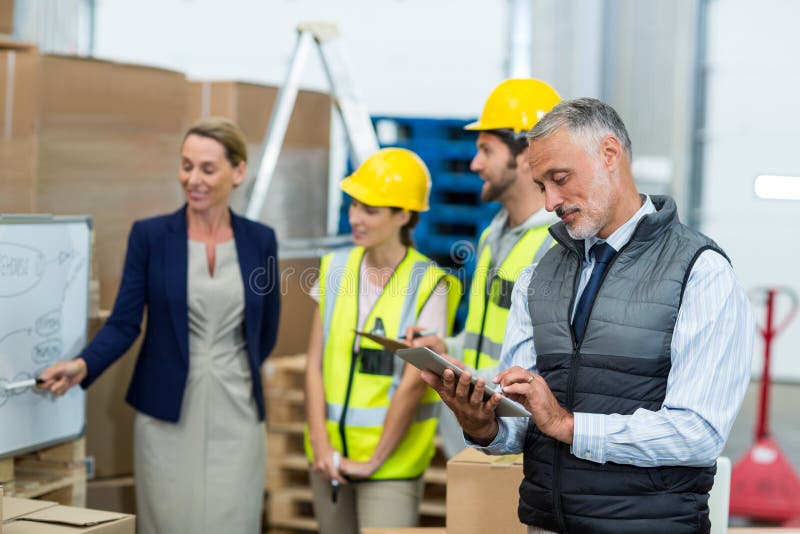 Warehouse Team Having a Meeting Stock Image - Image of industrial ...