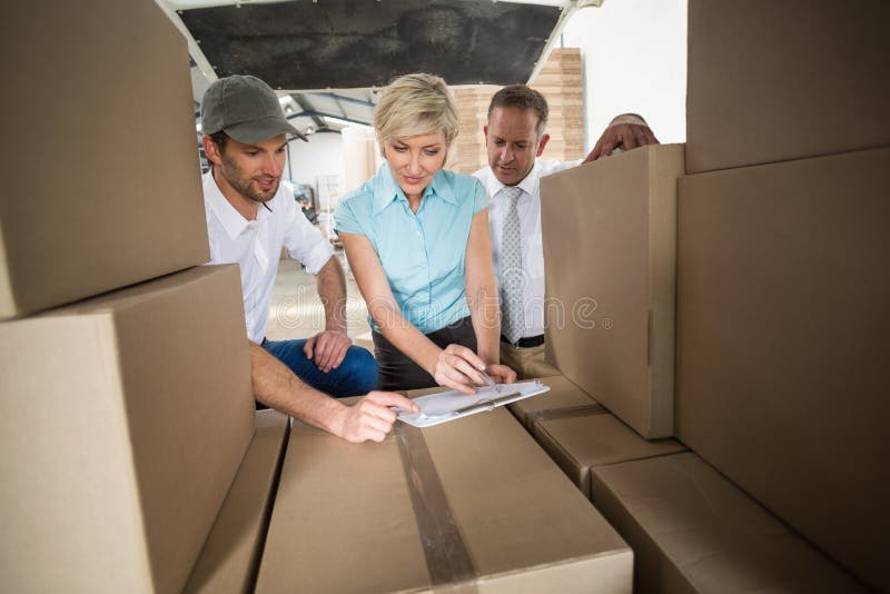 Warehouse Team Having A Meeting Stock Photo - Image of mature, helmet ...