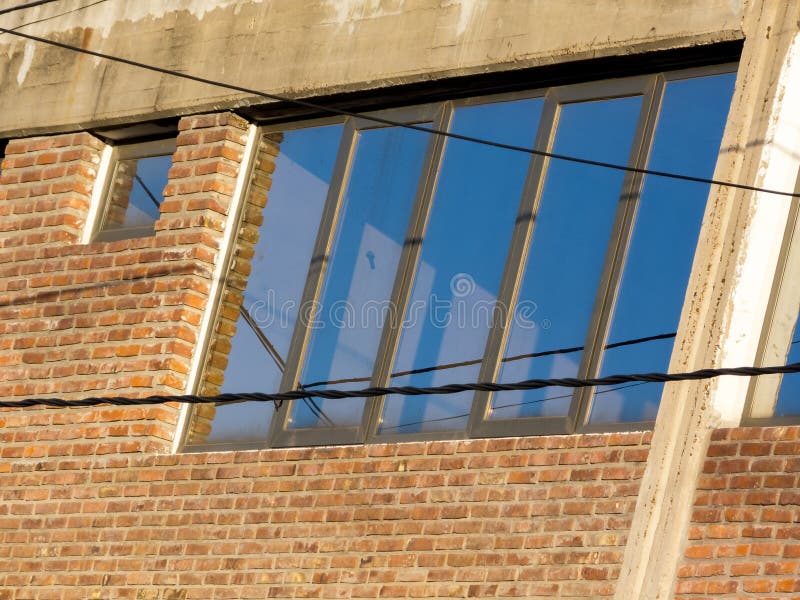 A Sunny Day Inside a Rustic Barn with Chickens Roaming among Straw ...