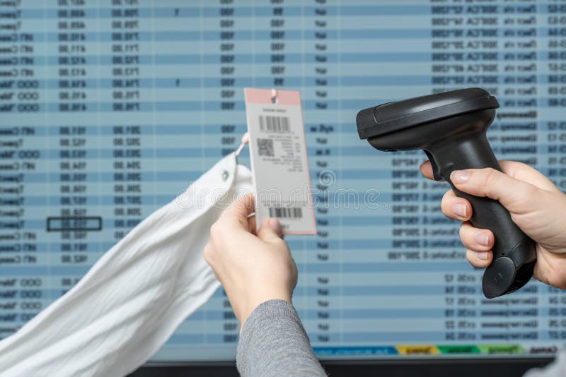 A Warehouse Woman Employee Accepts Cargo, Goods Using Barcode Scanner ...