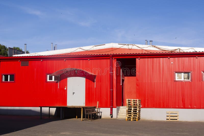 Warehouse, Wooden Pallets Near the Red Building Stock Image - Image of ...