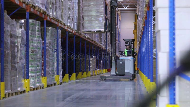 Warehouse Work. Workflow in a Large Warehouse. Special Equipment in the ...