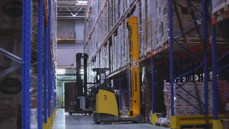 Warehouse Work. Workflow in a Large Warehouse. Special Equipment in the ...