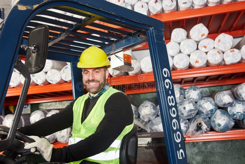 Warehouse Worker As a Forklift Driver in the Warehouse Stock Image ...