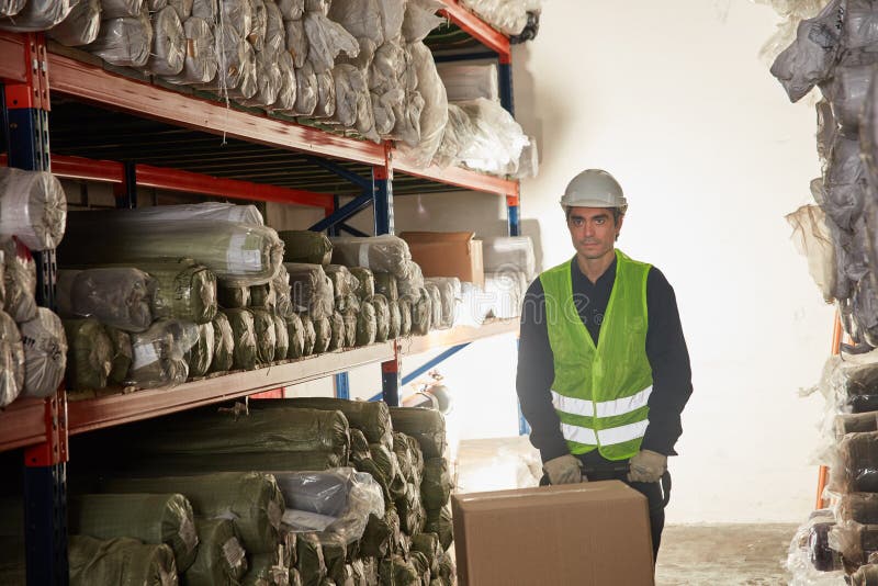 Warehouse Worker As a Packager with a Package Stock Image - Image of ...