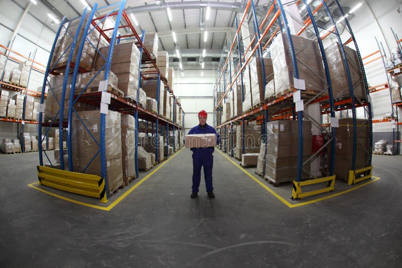 Warehouse worker with box stock photo. Image of duty - 12577792