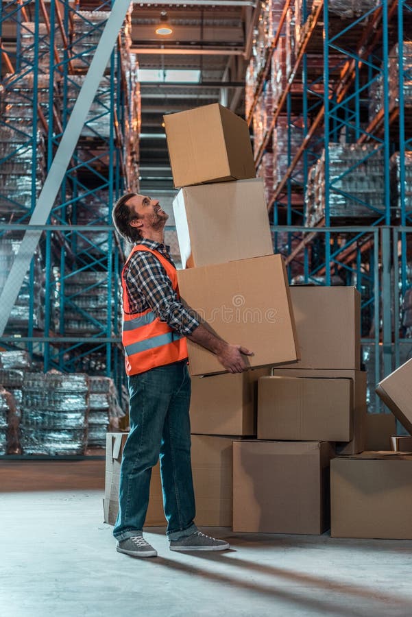 Side View of Male Warehouse Worker Holding Stock Image - Image of boxes ...