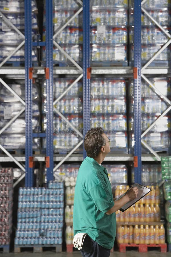 Warehouse Worker Checking Inventory Stock Photo - Image of occupation ...