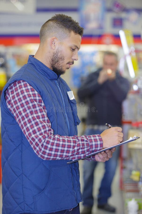 Warehouse Worker with Clipboard in Warehouse Stock Photo - Image of ...
