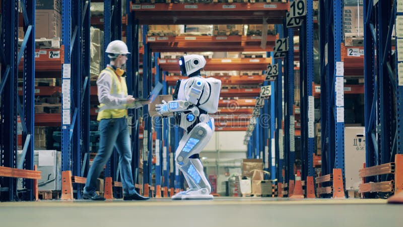 Warehouse Worker Working with Delivery Robot Stock Footage - Video of ...