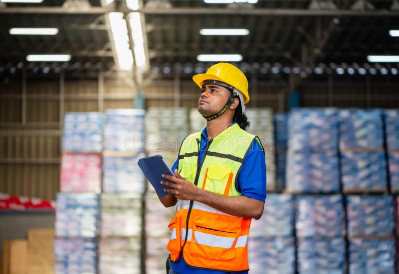 Warehouse Worker with Digital Tablet Checking Inventory in Warehouse ...