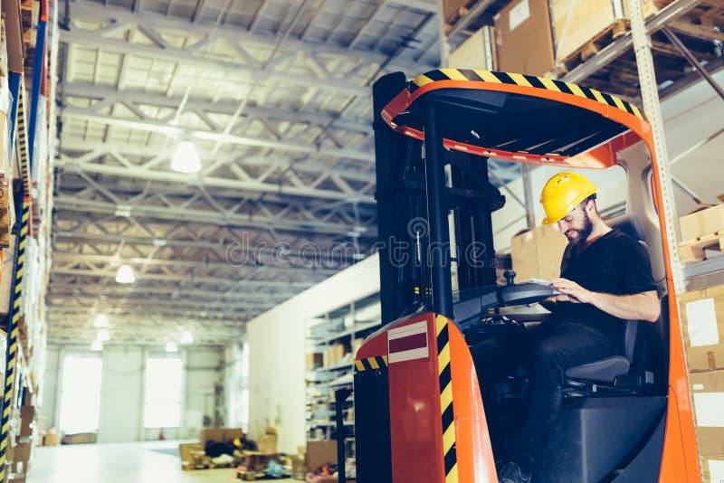 Warehouse Worker Doing Logistics Work with Forklift Loader Stock Photo ...