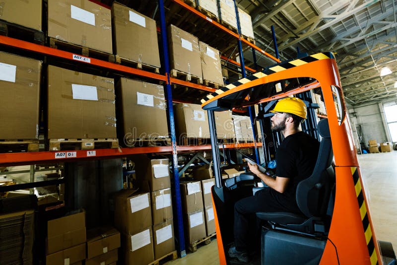 Warehouse Worker Doing Logistics Work with Forklift Loader Stock Photo ...