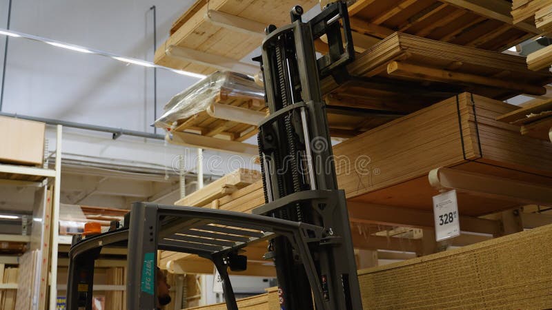 Warehouse Worker Driver in Uniform Loading Lumber by Forklift Stacker ...