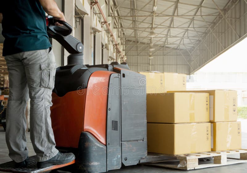 Warehouse Worker Driving Electric Forklift Pallet Jack Loading Shipment ...