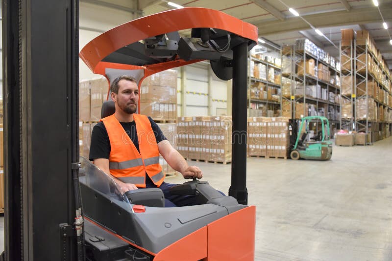 Warehouse Worker in a Forwarding Agency - Interior with Forklift ...