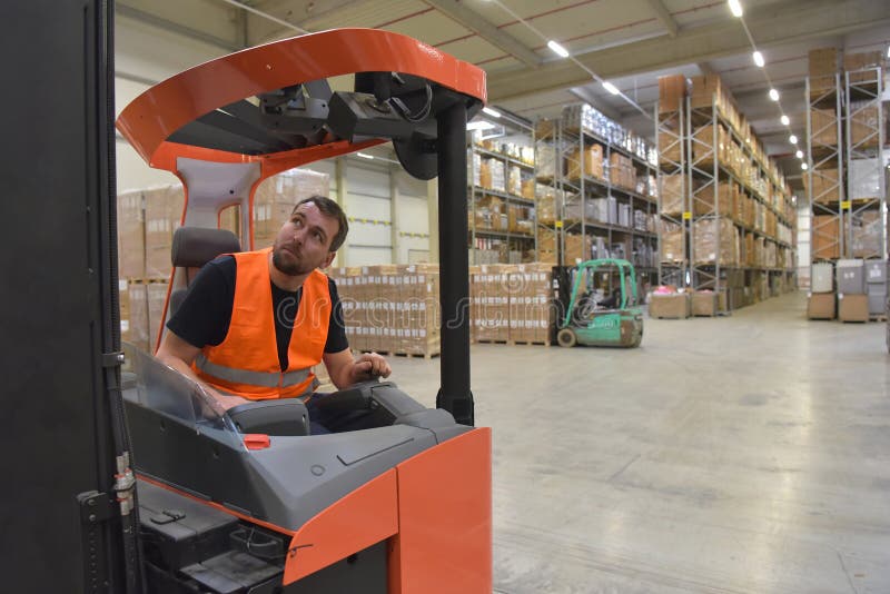 Warehouse Worker in a Forwarding Agency - Interior with Forklift ...