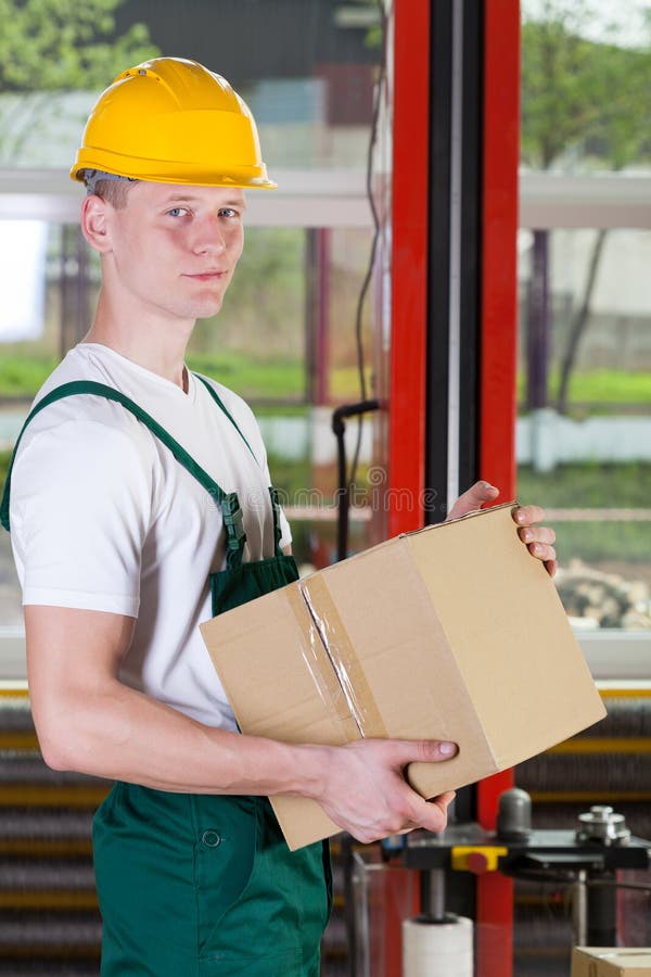 Warehouse Worker Holding Box Stock Photo - Image of employee, factory ...