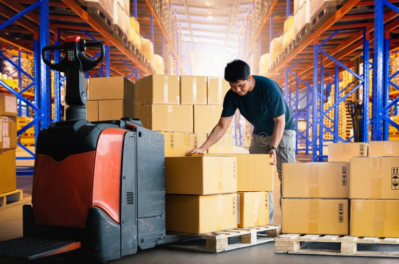 Asian Warehouse Worker Scanning Bar Code Scanner on Package Box ...
