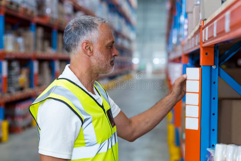 Warehouse Worker Looking in the Shelf Stock Image - Image of factory ...