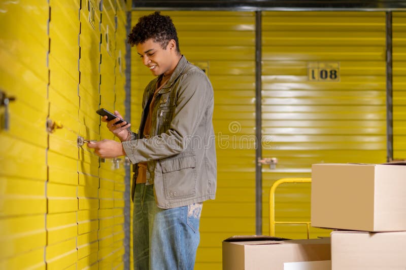 Warehouse Worker Opening the Smart Lock Stock Image - Image of indoors ...