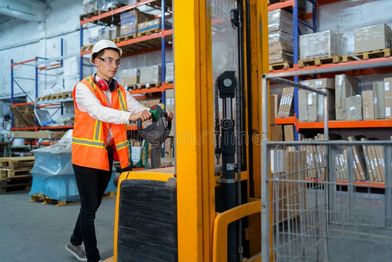Warehouse Worker Operates a Pallet Loader. Stock Photo - Image of ...