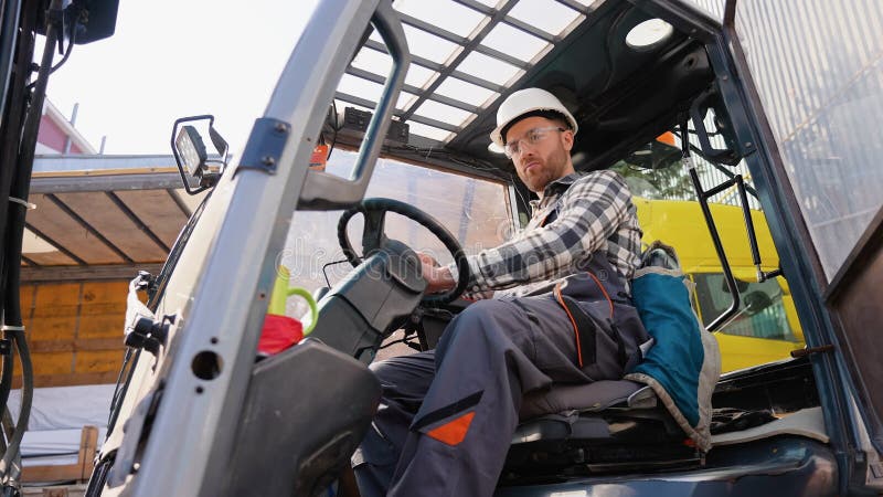 Warehouse Worker Operating a Forklift Loader Stock Video - Video of ...