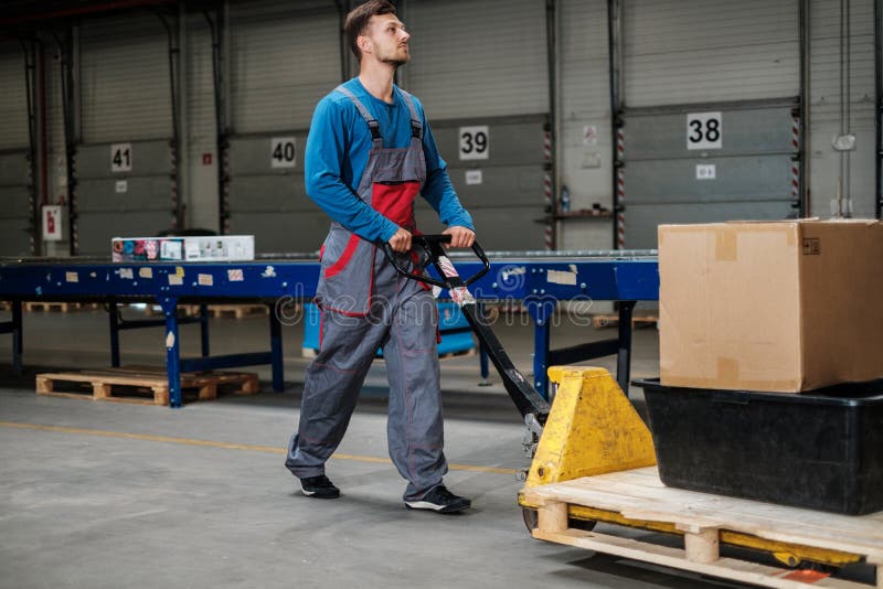 Warehouse Worker with a Pallet Rack Stock Photo - Image of dispatch ...