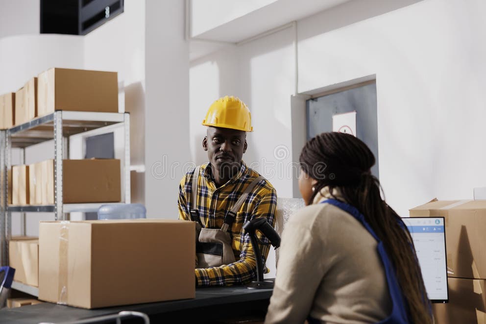 Warehouse Worker Putting Parcel on Counter Desk for Dispatching Stock ...