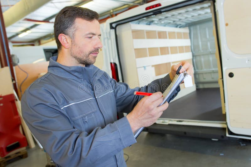Warehouse Worker Reading Report Stock Photo - Image of export, forklift ...