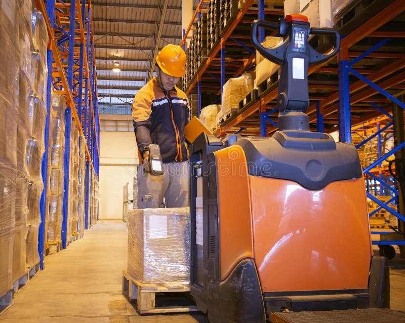 Warehouse Worker Scanning Bar Code Scanner with Shipment Goods Pallet ...