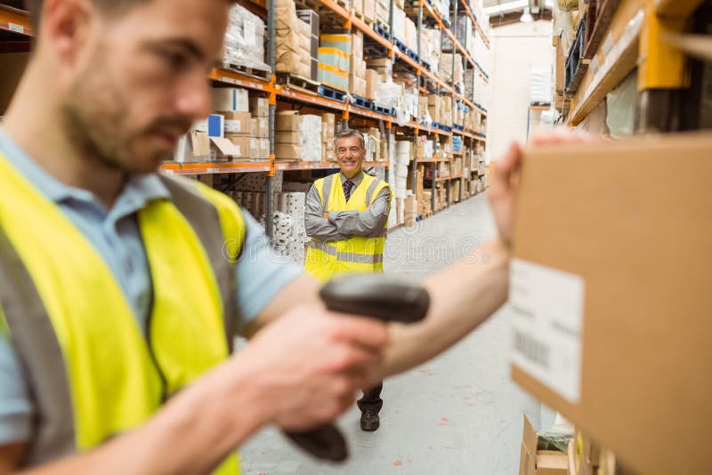 Warehouse Worker Scanning Barcode on Box Stock Image - Image of ...