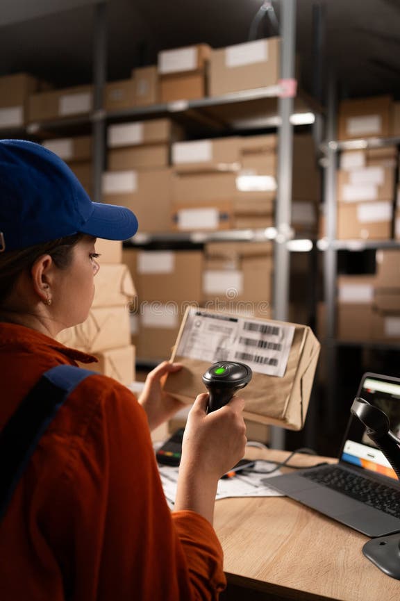 Warehouse Worker Scanning Barcode on Parcel Using Barcode Scanner ...