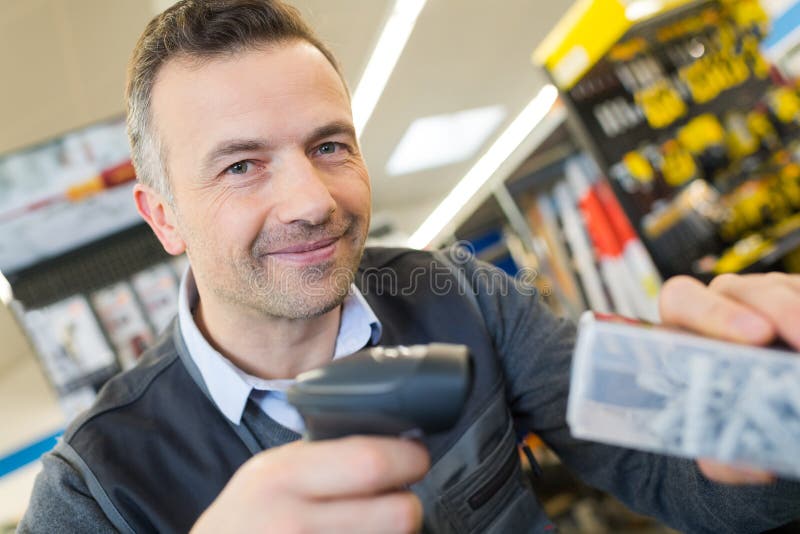 Warehouse Worker Scanning Box while Smiling at Camera Stock Image ...