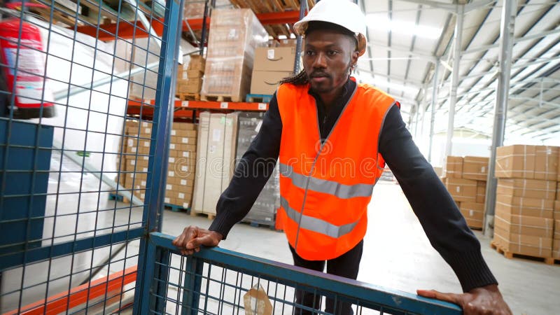 Warehouse Worker Skillfully Opening a Heavy Metal Gate for Efficient ...