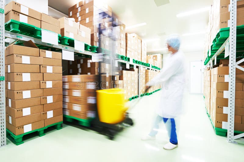 Warehouse stacker at work stock photo. Image of operator - 19304648