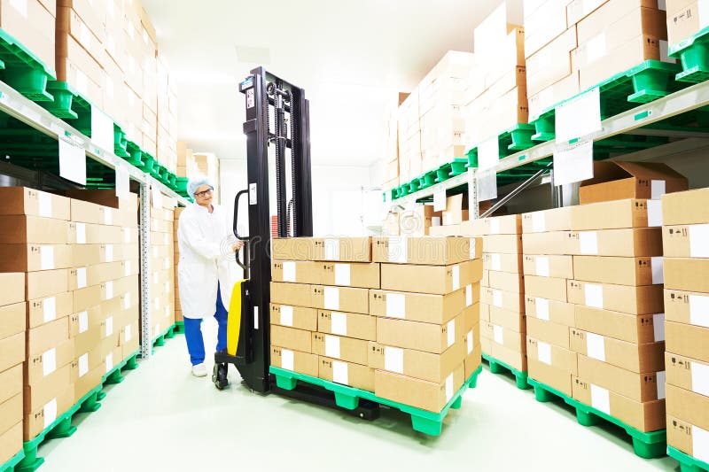 Warehouse stacker at work stock photo. Image of operator - 19304648