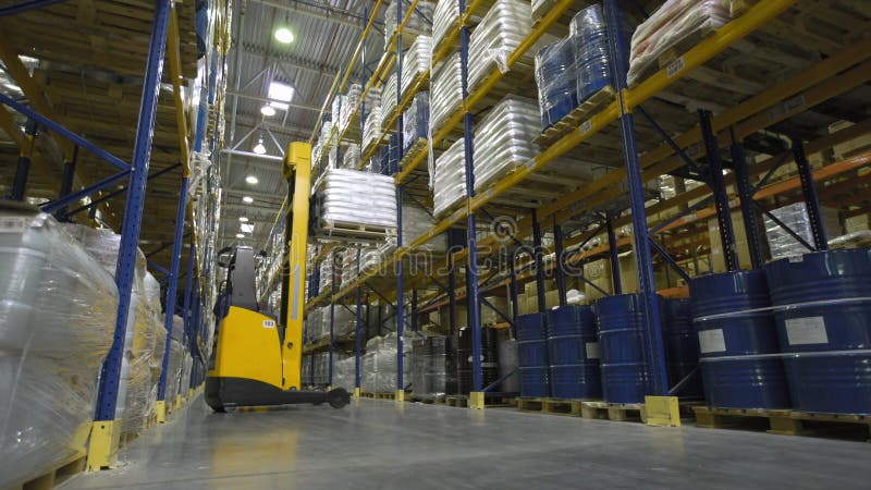Warehouse Worker on Stacker Loading Cargo on Shelf Stock Video - Video ...