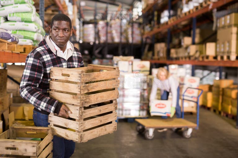 Warehouse Worker Stacking Wooden Boxes Stock Image - Image of industry ...