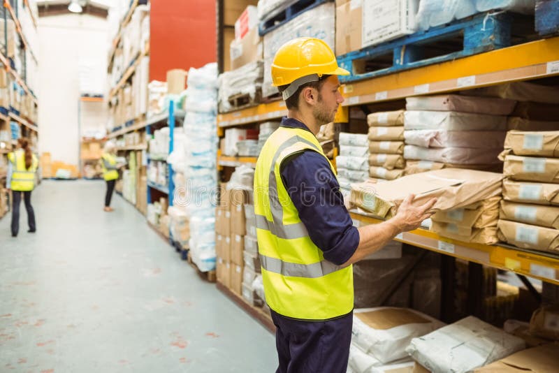 Warehouse Worker Taking Package in the Shelf Stock Image - Image of ...