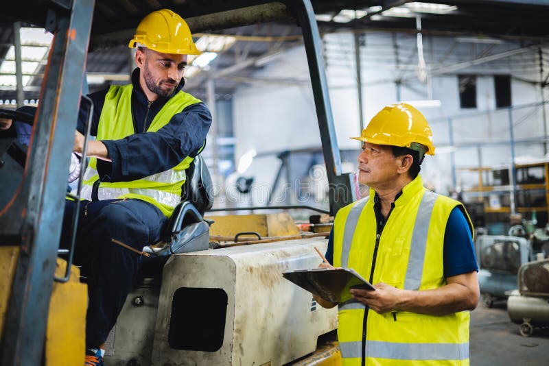 Warehouse Worker Talking with Forklift Operator in Factory Stock Photo ...