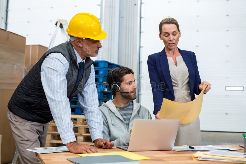 Warehouse Team Having a Meeting Stock Photo - Image of beard, container ...
