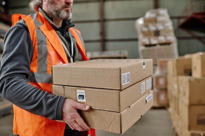Warehouse Worker Unloading Goods in Storehouse Stock Photo - Image of ...