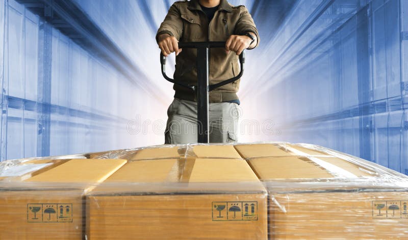 Warehouse Worker Unloading Package Boxes in the Storage Warehouse ...