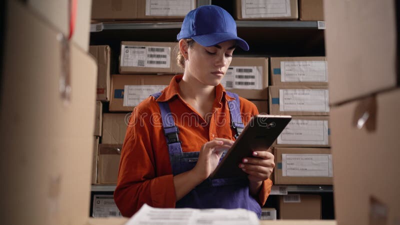 Warehouse Worker Uses Digital Tablet for Checking Stock Standing Near ...